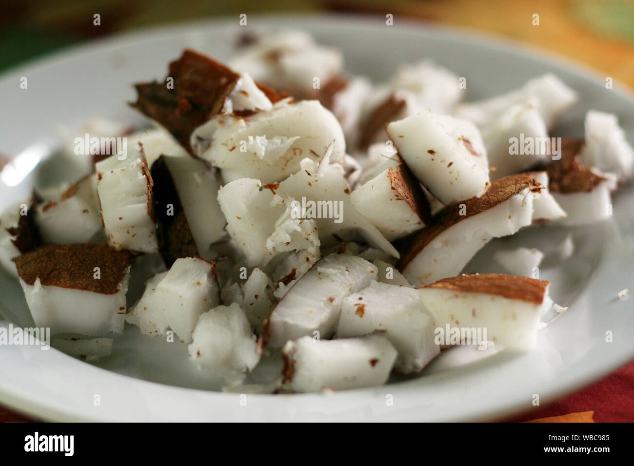 close up of chopped pieces of coconut on a white plate Stock Photo - Alamy