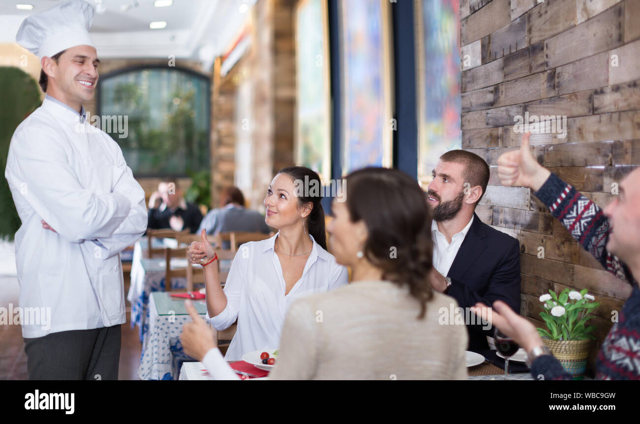 Professional cook chef talking with guests in the restaurant Stock ...