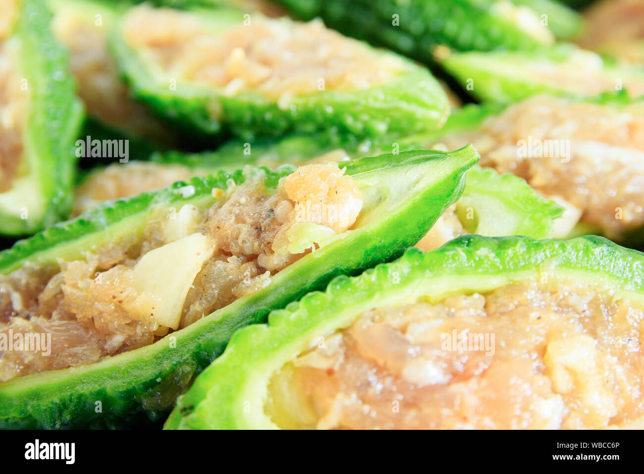 Close up bitter gourd pile with stuffed hack pork and garlic black ...