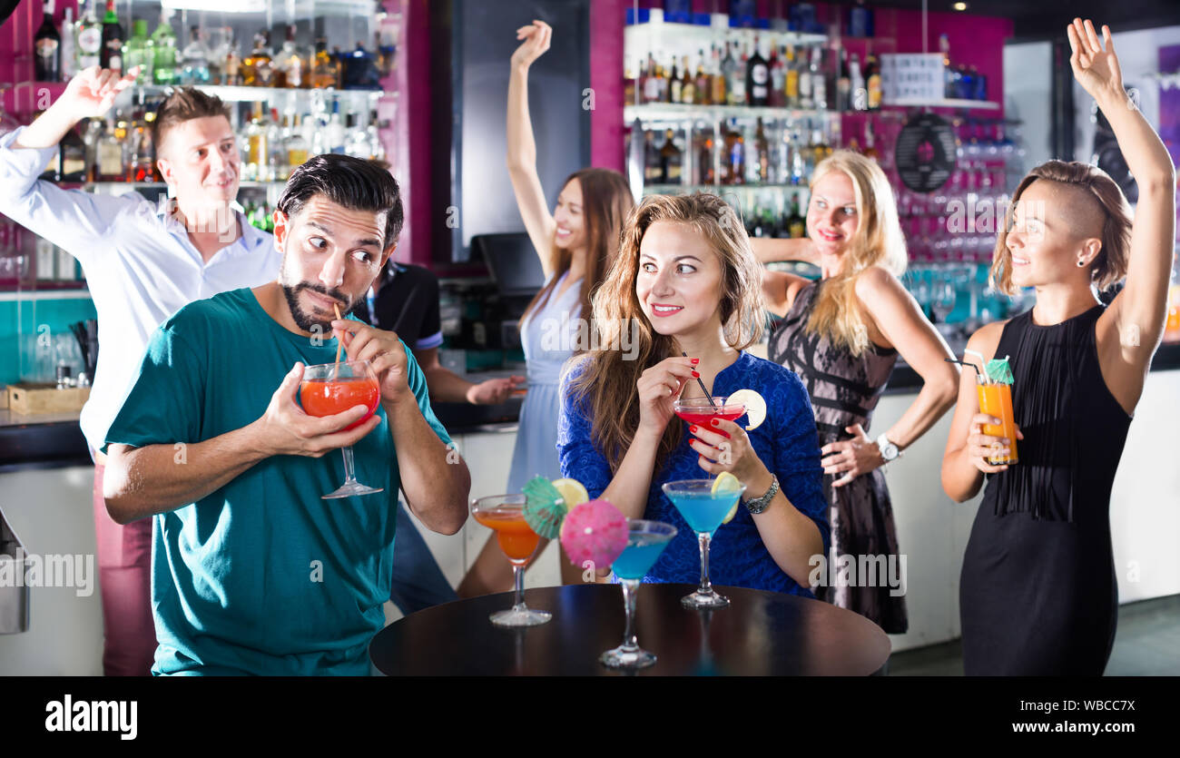 Young students dancing on party with a cocktails in the club Stock ...