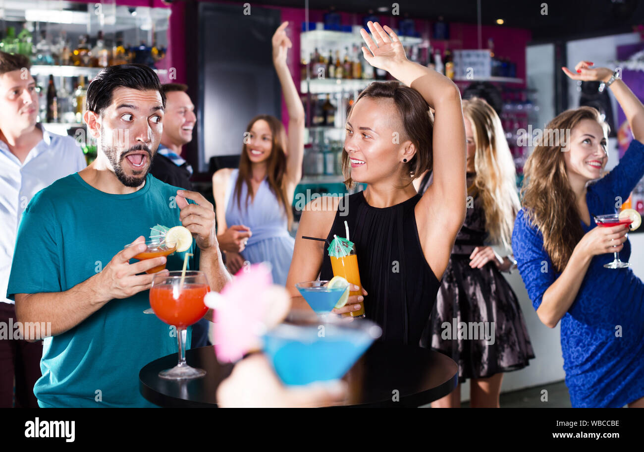 Young students dancing on party with the cocktails at a club Stock ...