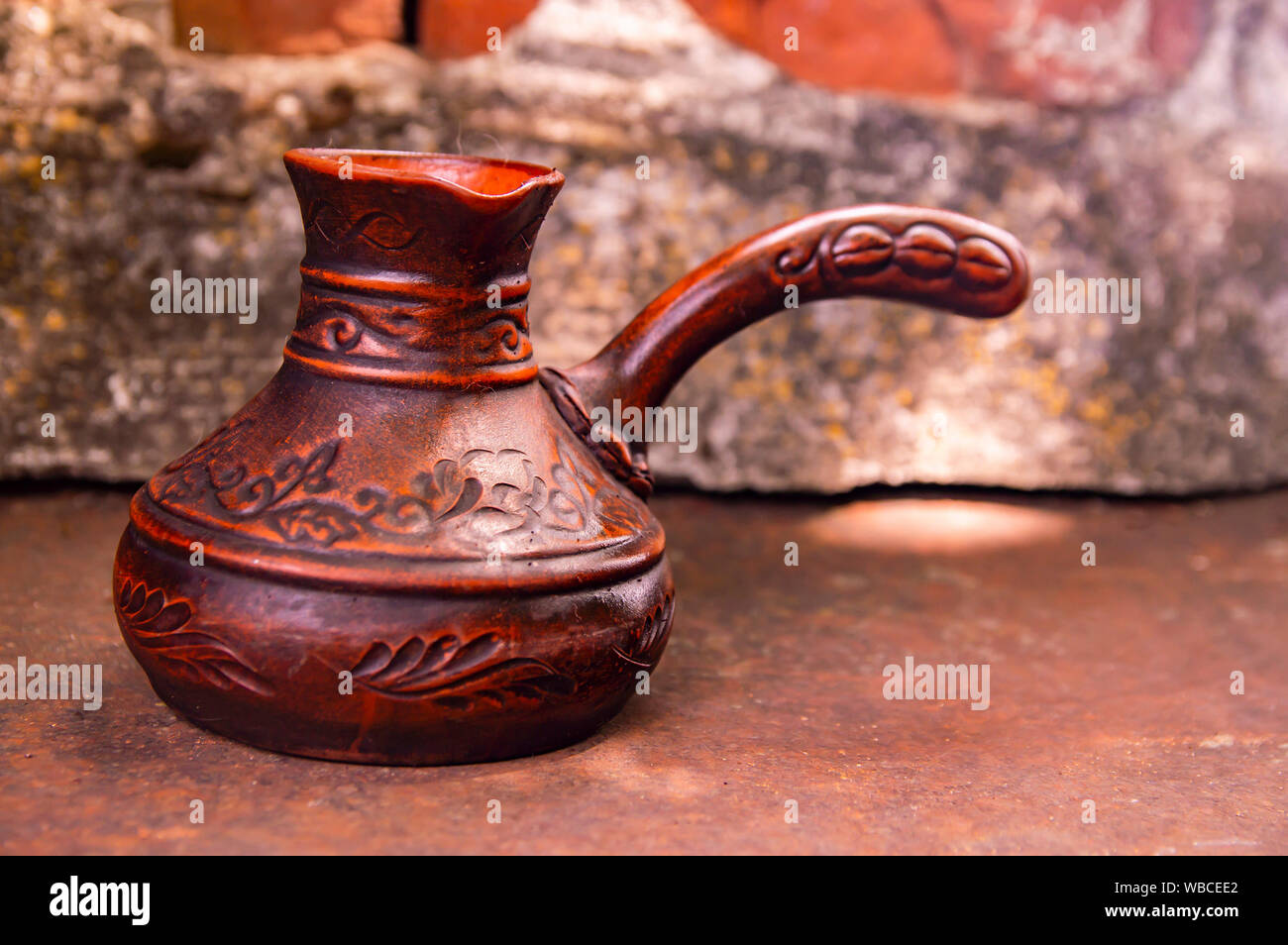 Clay Turk for coffee on a brick wall background. Background Stock Photo ...