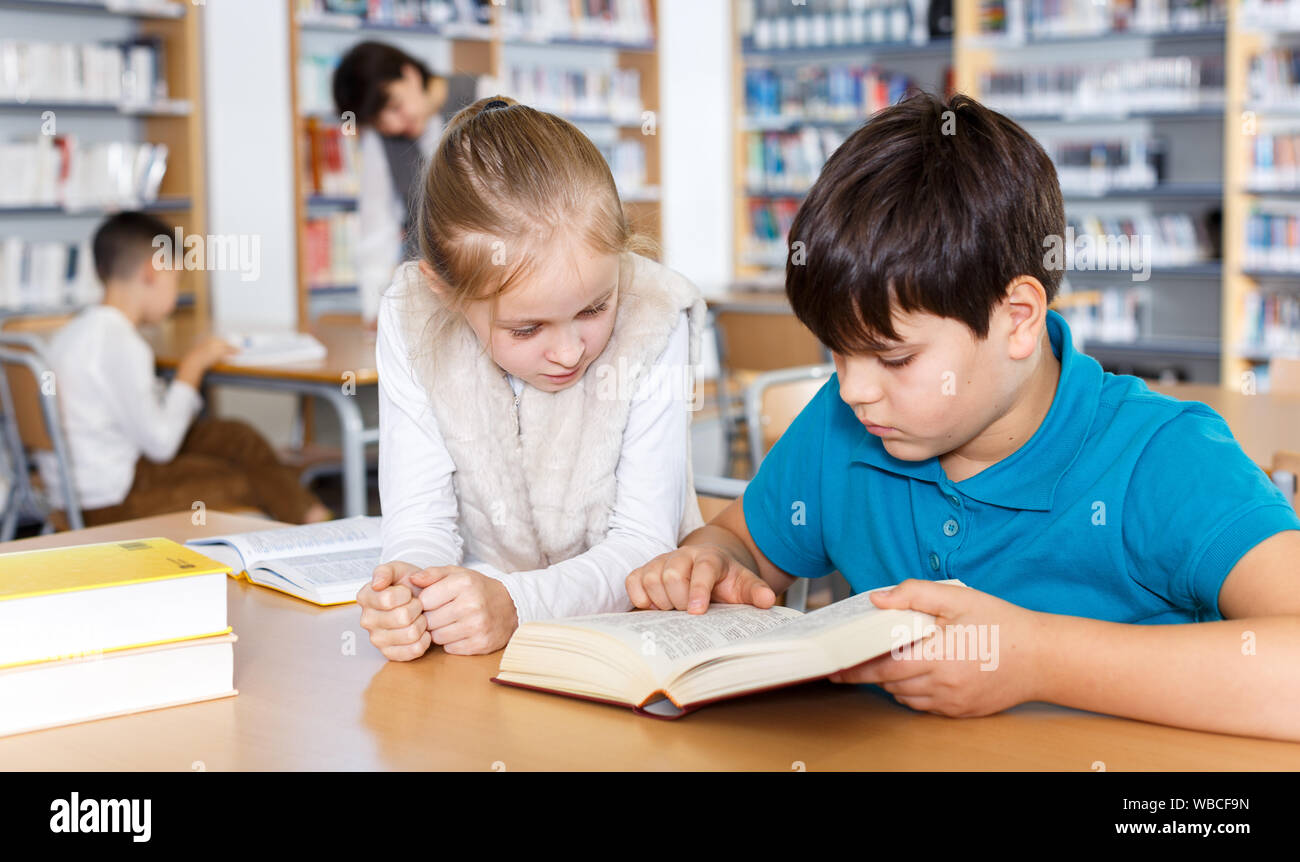Positive intelligent boy reading hi-res stock photography and images ...