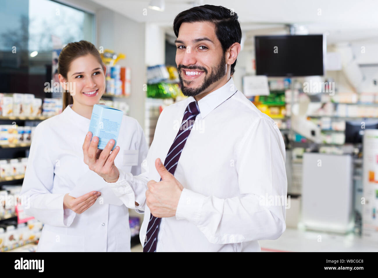 happy adult man client who is satisfied of recommended medicines in ...