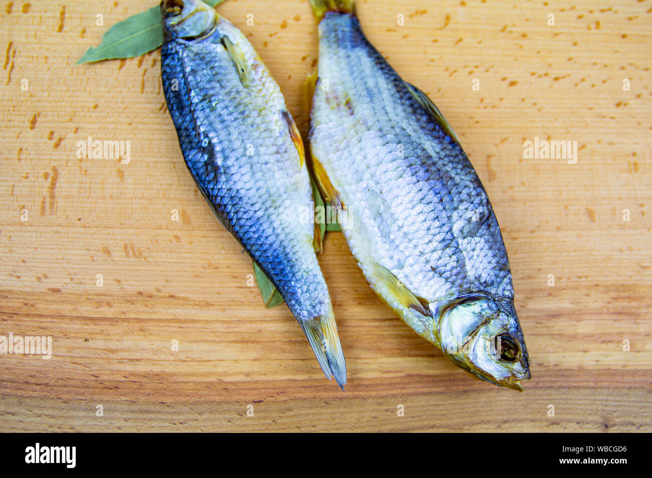 Dried fish Roach on a wooden cutting board. Food and drink Stock Photo ...