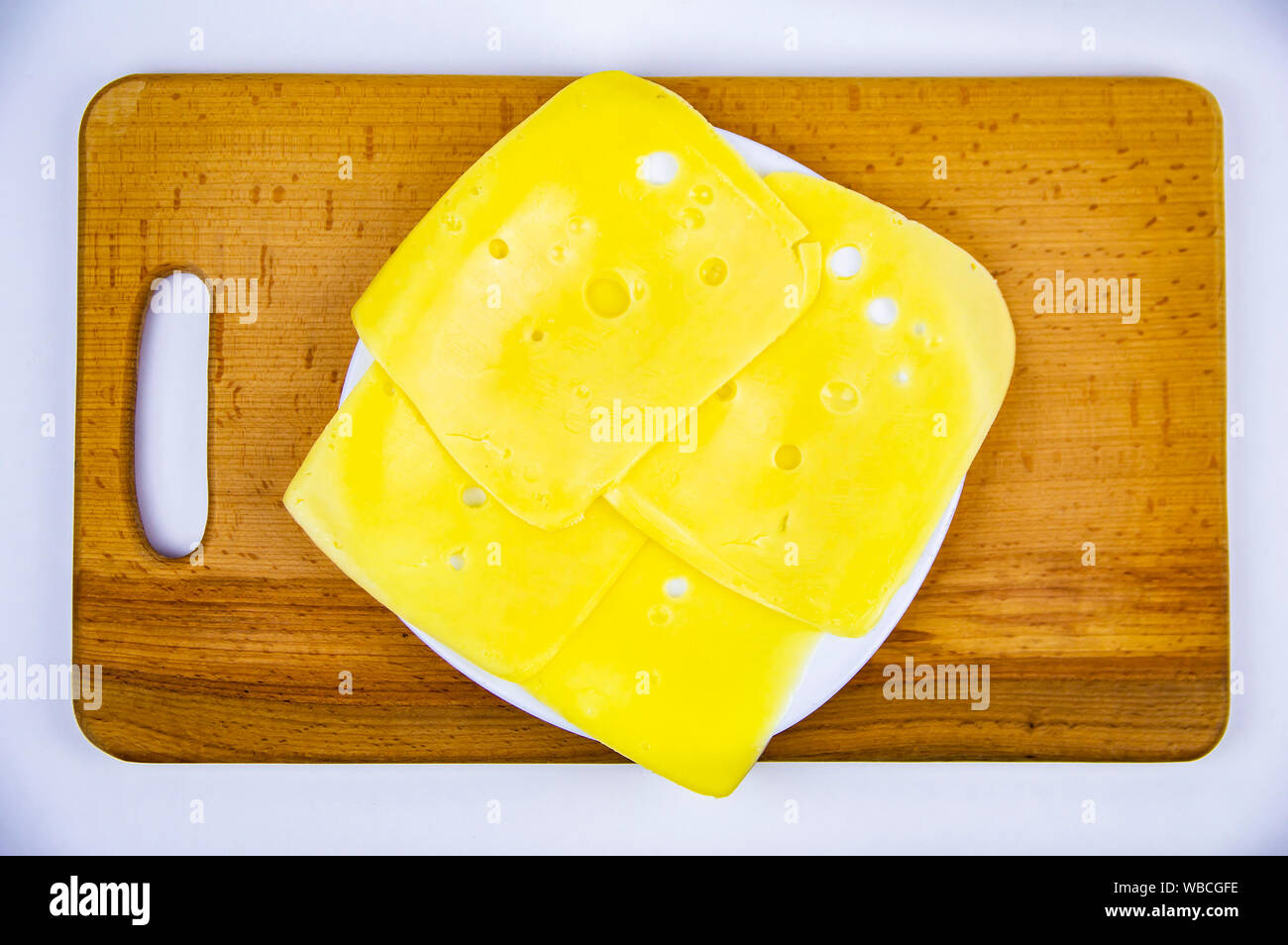 Hard cheese holes on cutting hi-res stock photography and images - Alamy