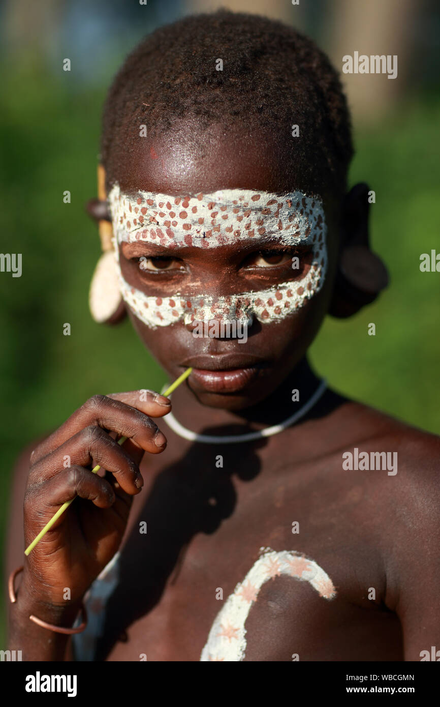 Beautiful tribal Suri girl at a ceremony in Lower Omo Valley near ...