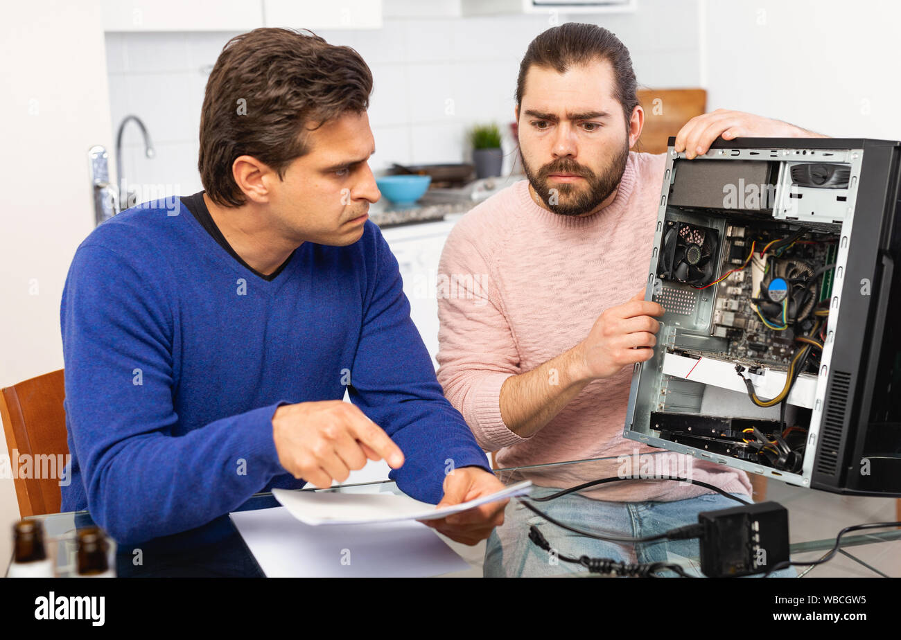 Men do not know how to repair a computer Stock Photo - Alamy