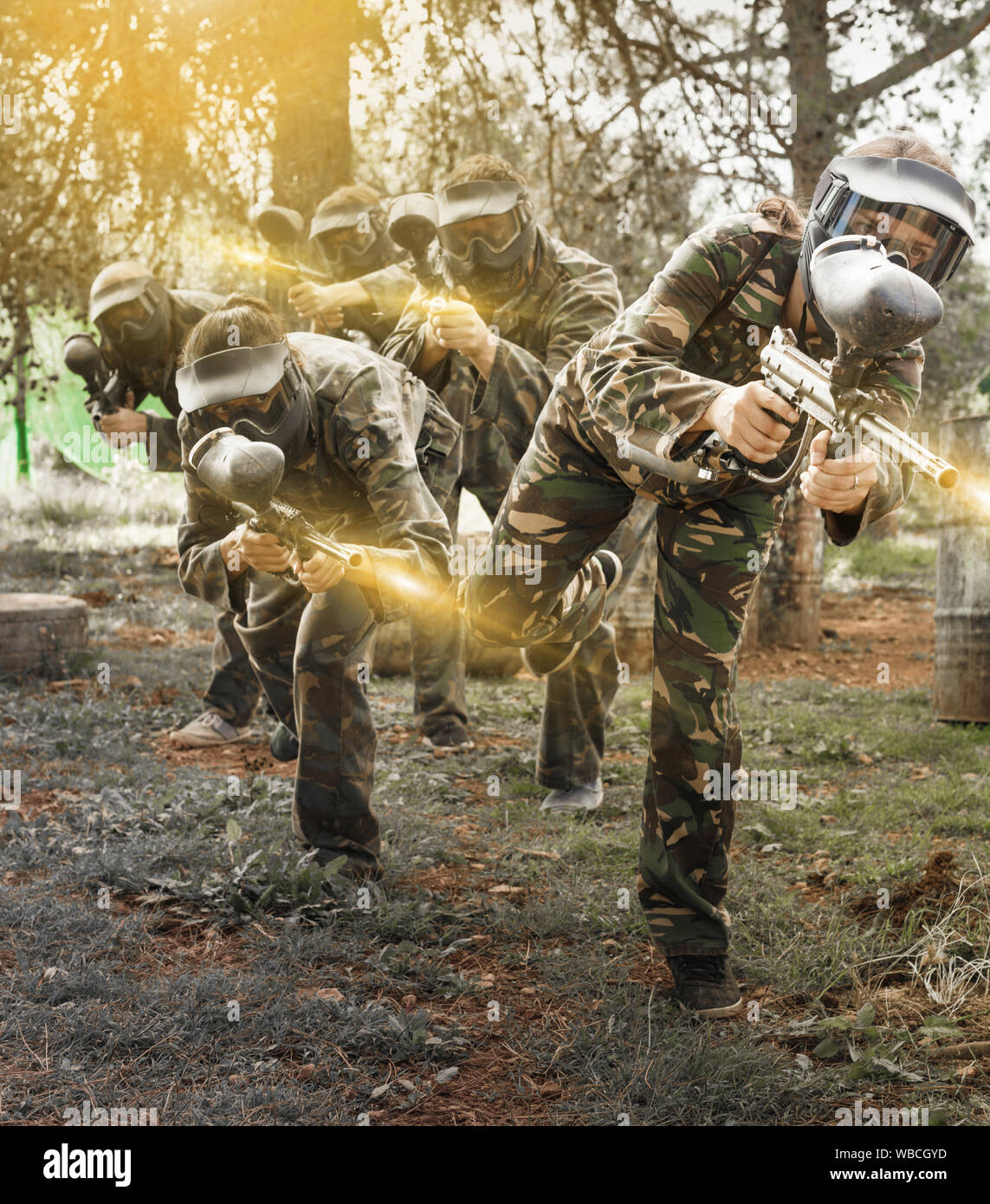 Portrait of team of happy cheerful positive adult people playing on ...