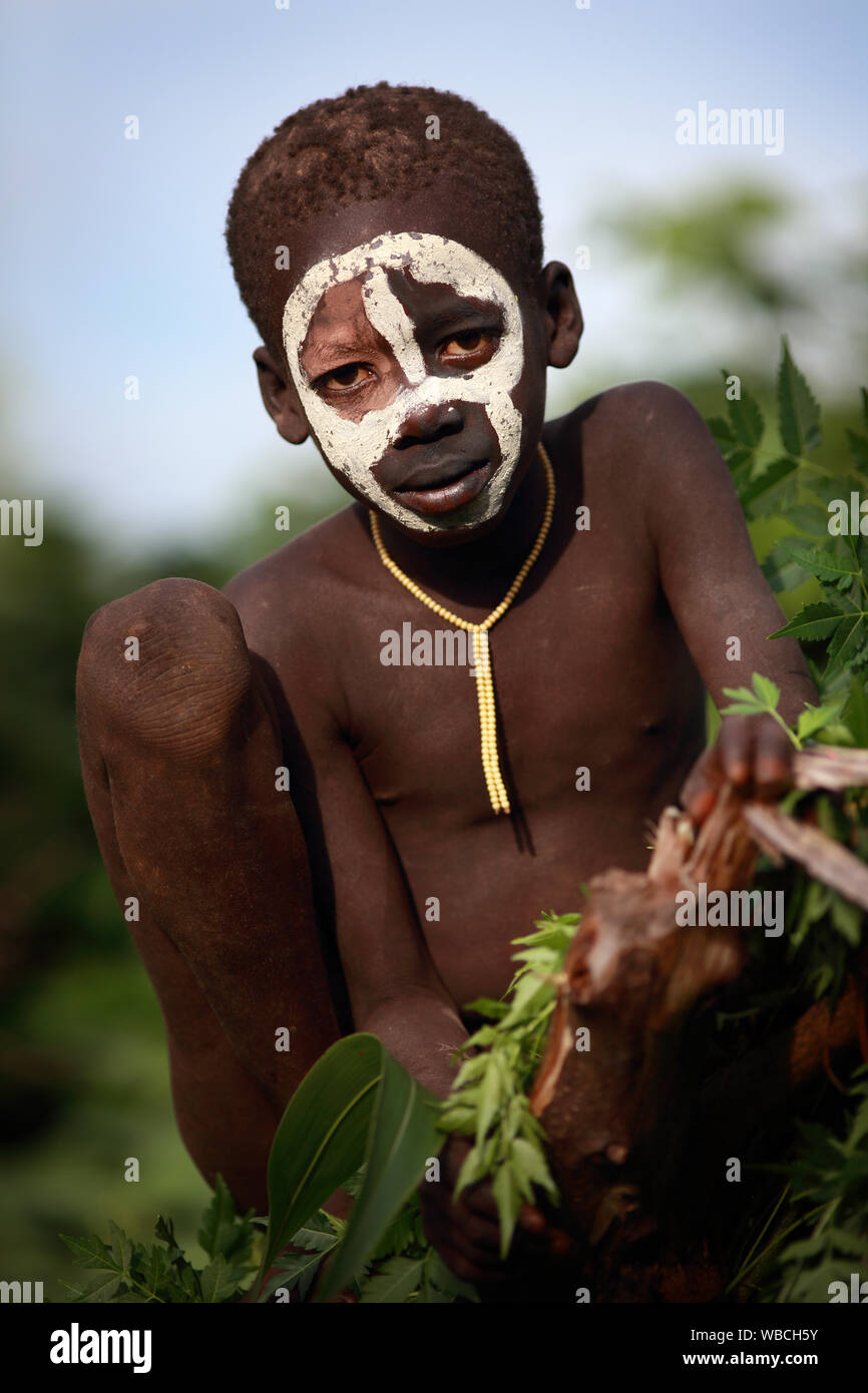Young tribal Suri boy at a ceremony in Lower Omo Valley near Kibish ...