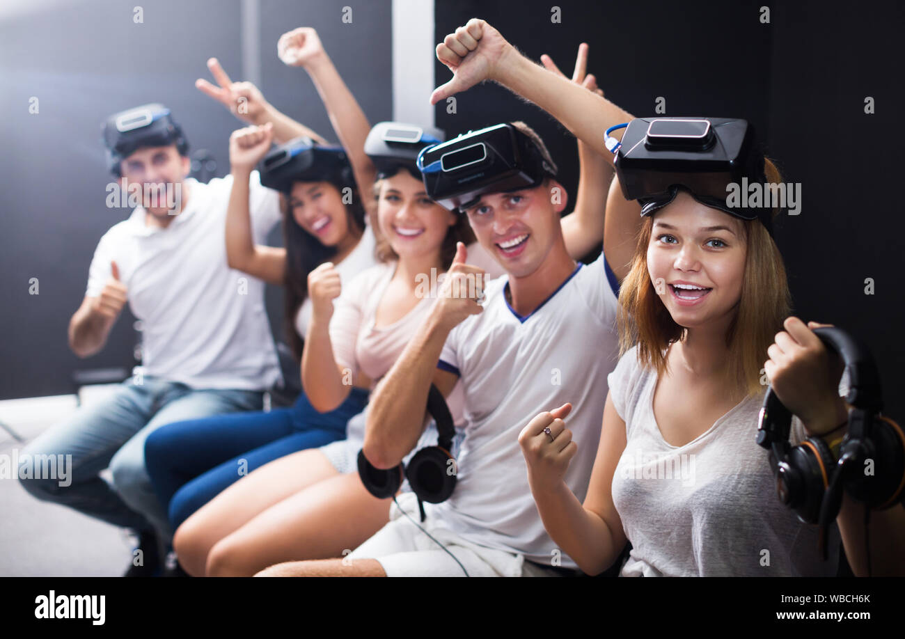 Happy adult people expressing satisfaction with vr attraction showing ...