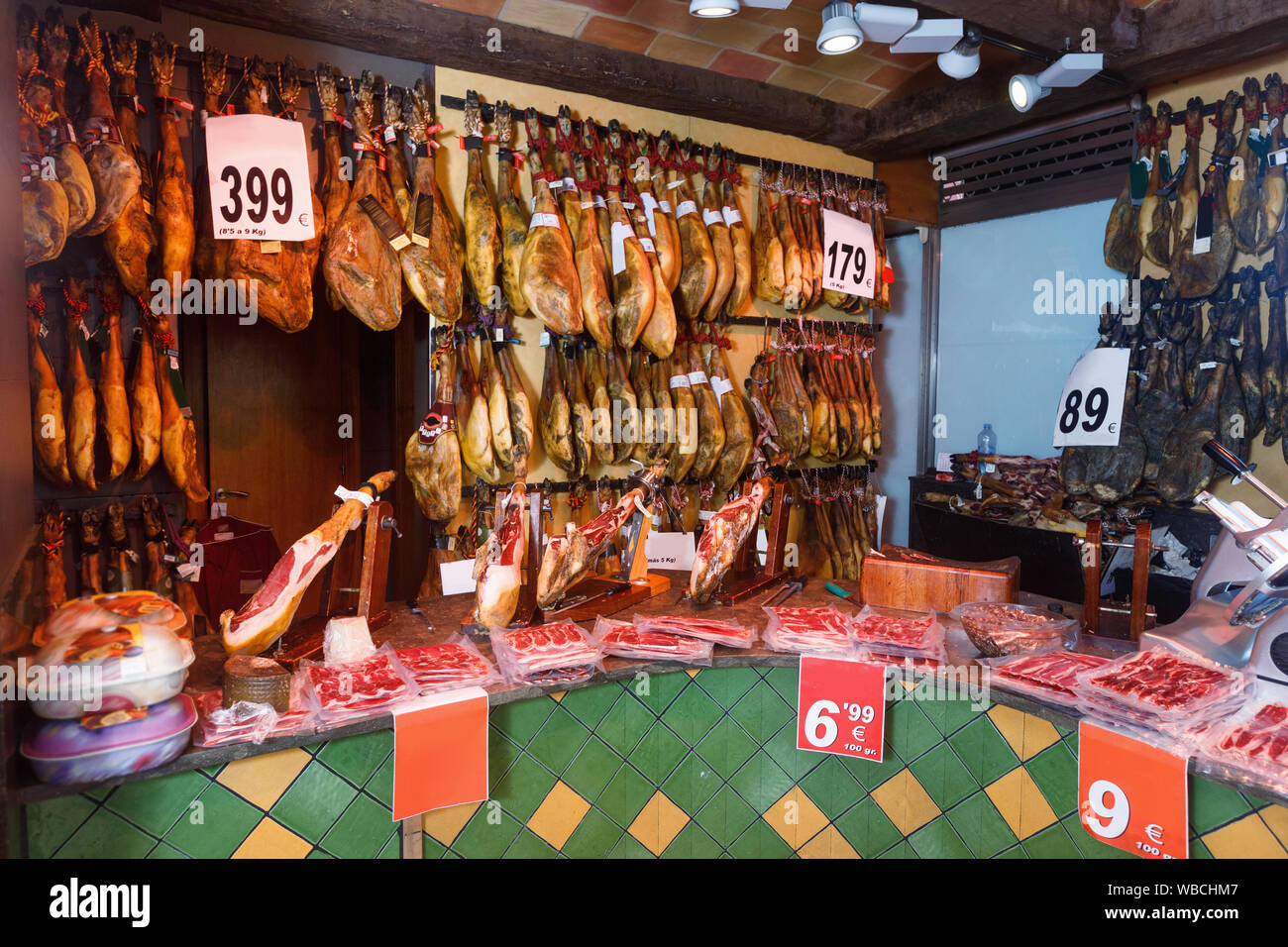 Assortment of traditional delicious appetizing meat shop with dangling ...