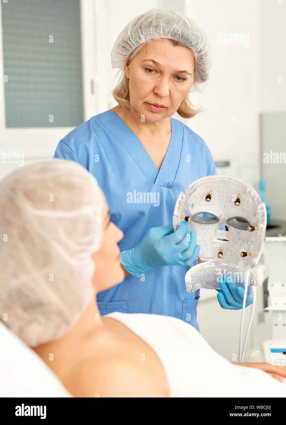 Conducting facial rejuvenation medical procedure using a mask with ...