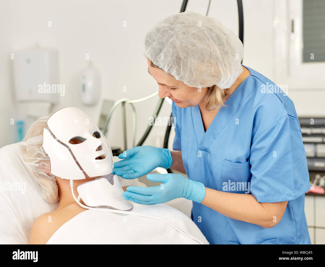 Positive girl expects plastic surgery in aesthetic cosmetology clinic ...