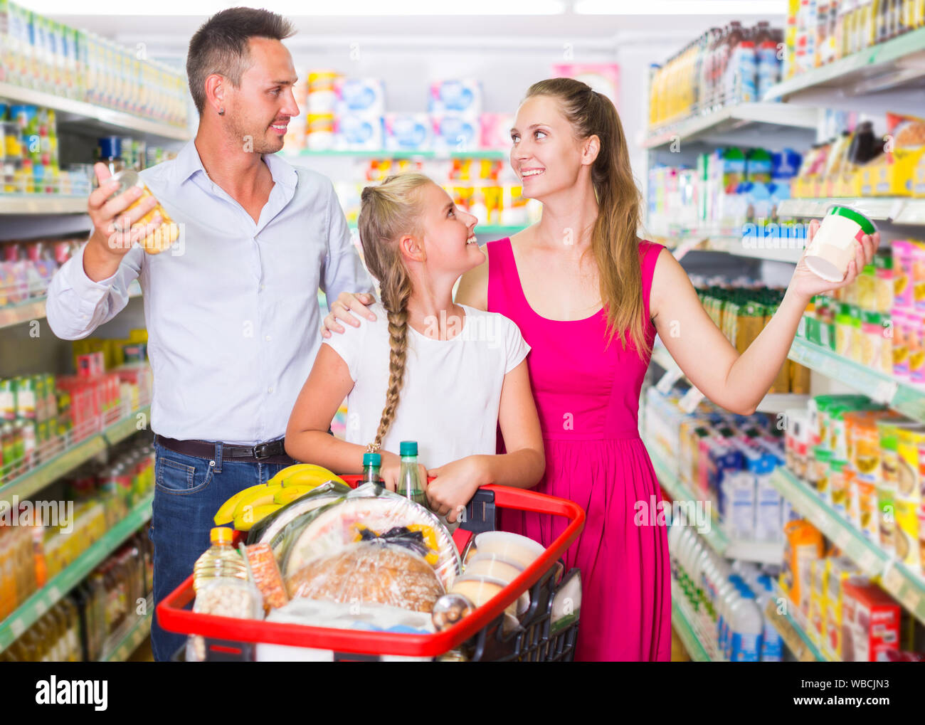 Customers are selecting goods in shop Stock Photo - Alamy