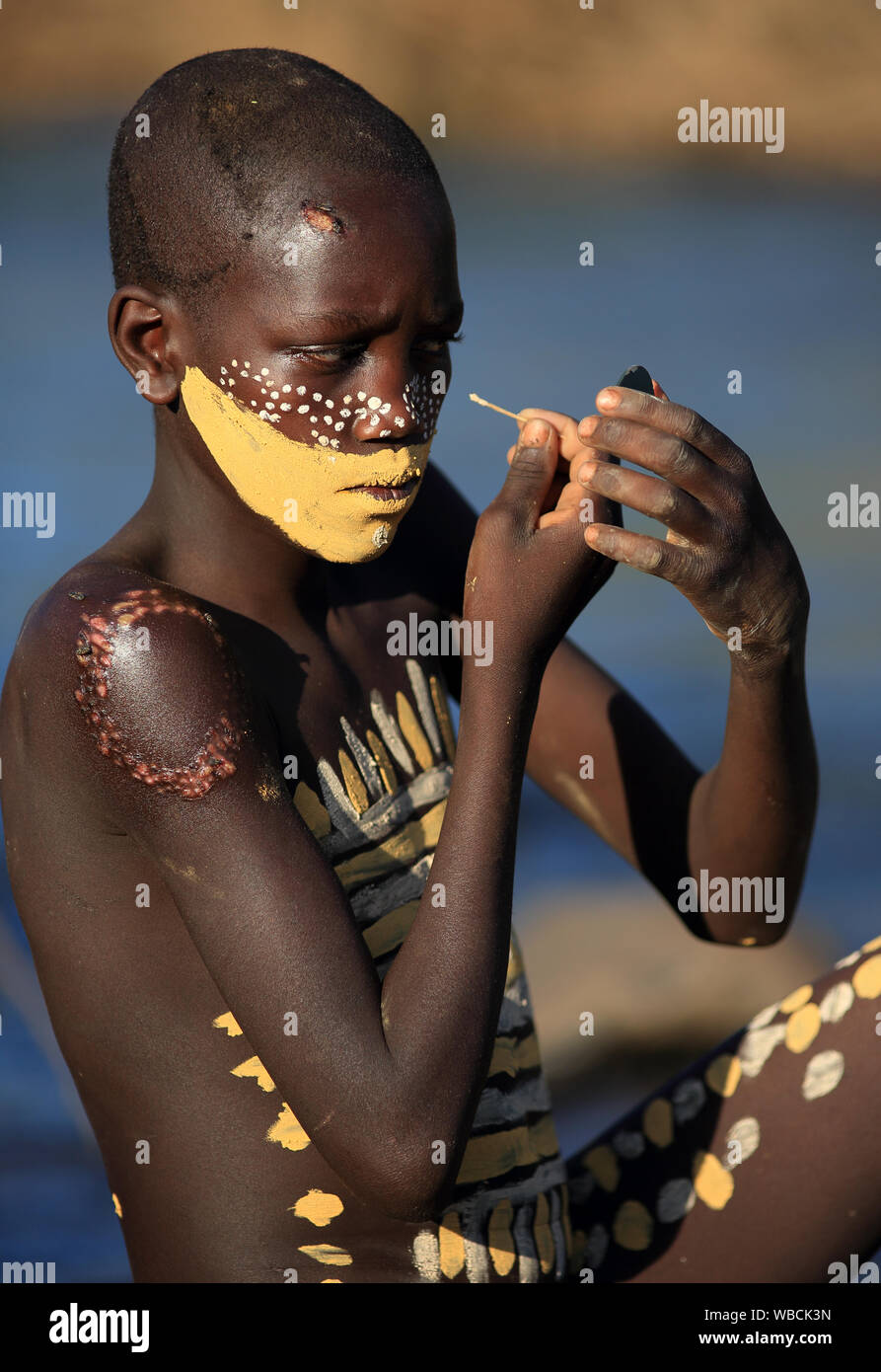 Young tribal Suri boy at a ceremony in Lower Omo Valley near Kibish ...