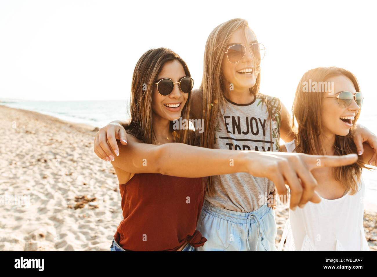 Laughing waving hi-res stock photography and images - Alamy