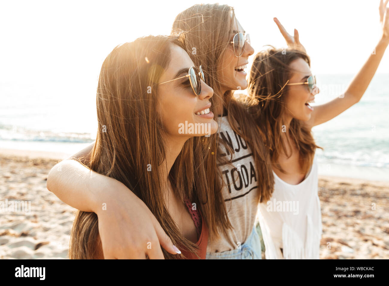 Laughing waving hi-res stock photography and images - Alamy