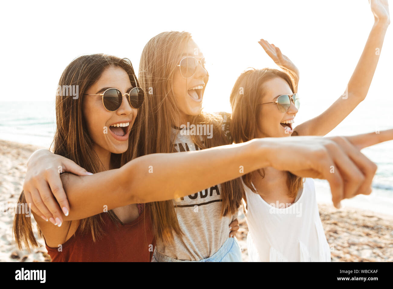 Laughing waving hi-res stock photography and images - Alamy