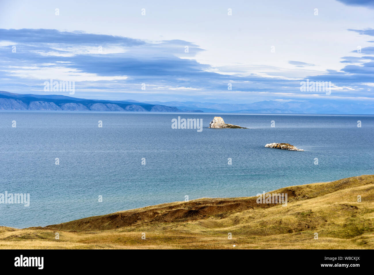 Lake Baikal and mountains of Siberia with beautiful sky and clouds ...