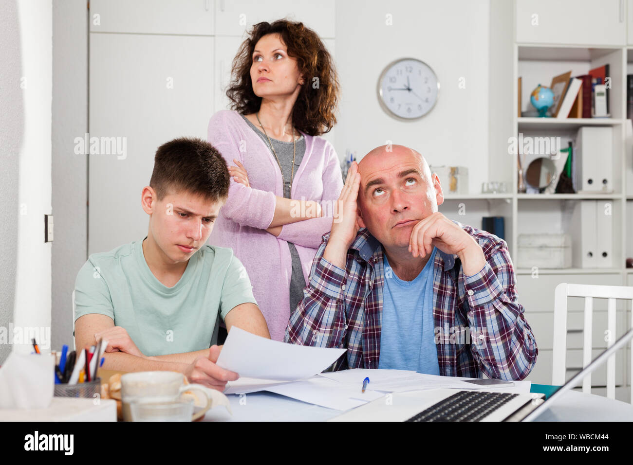 Worried teenager boy parents hi-res stock photography and images - Alamy