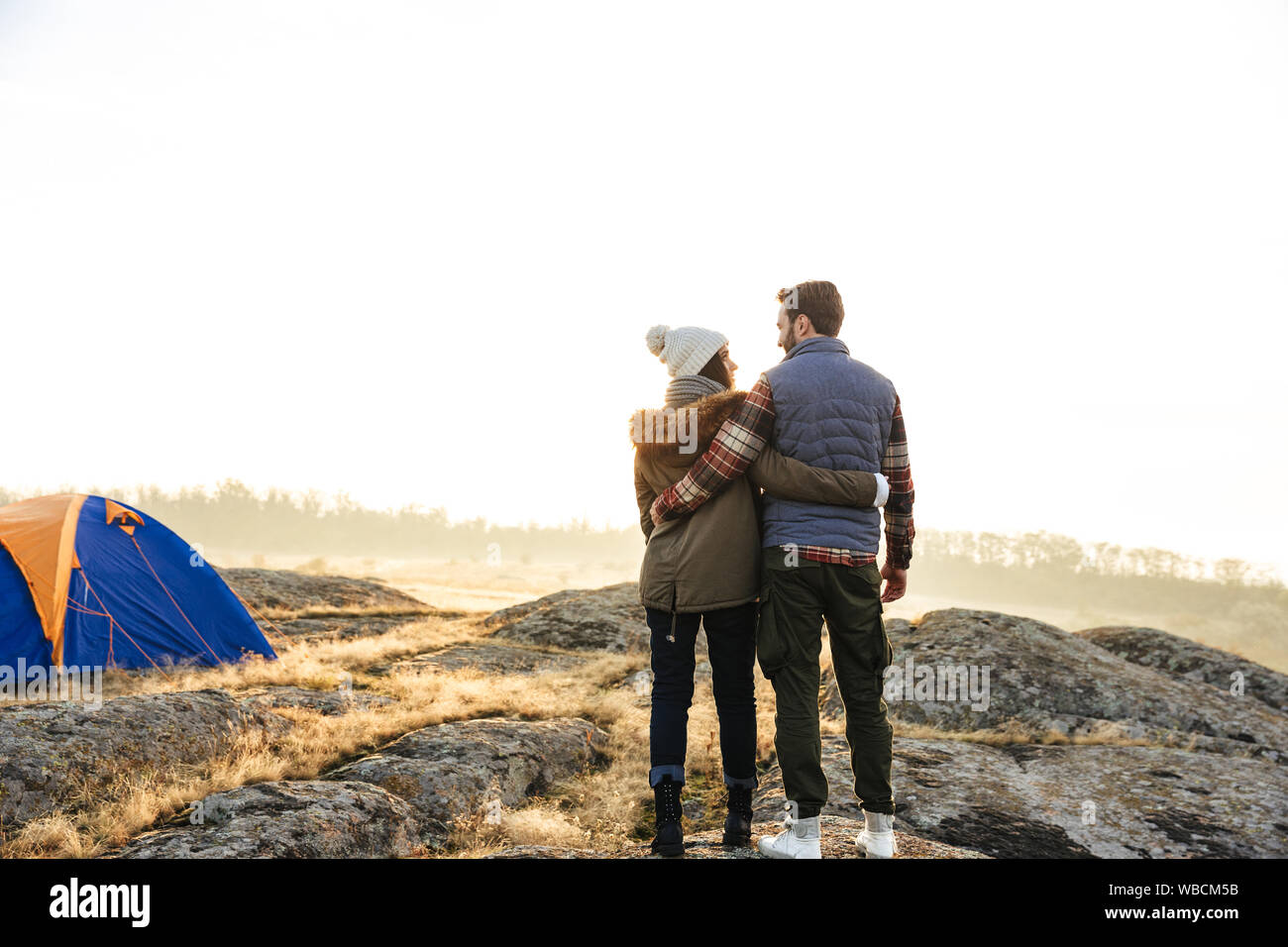 Photo of happy young loving couple outside with tent in free ...