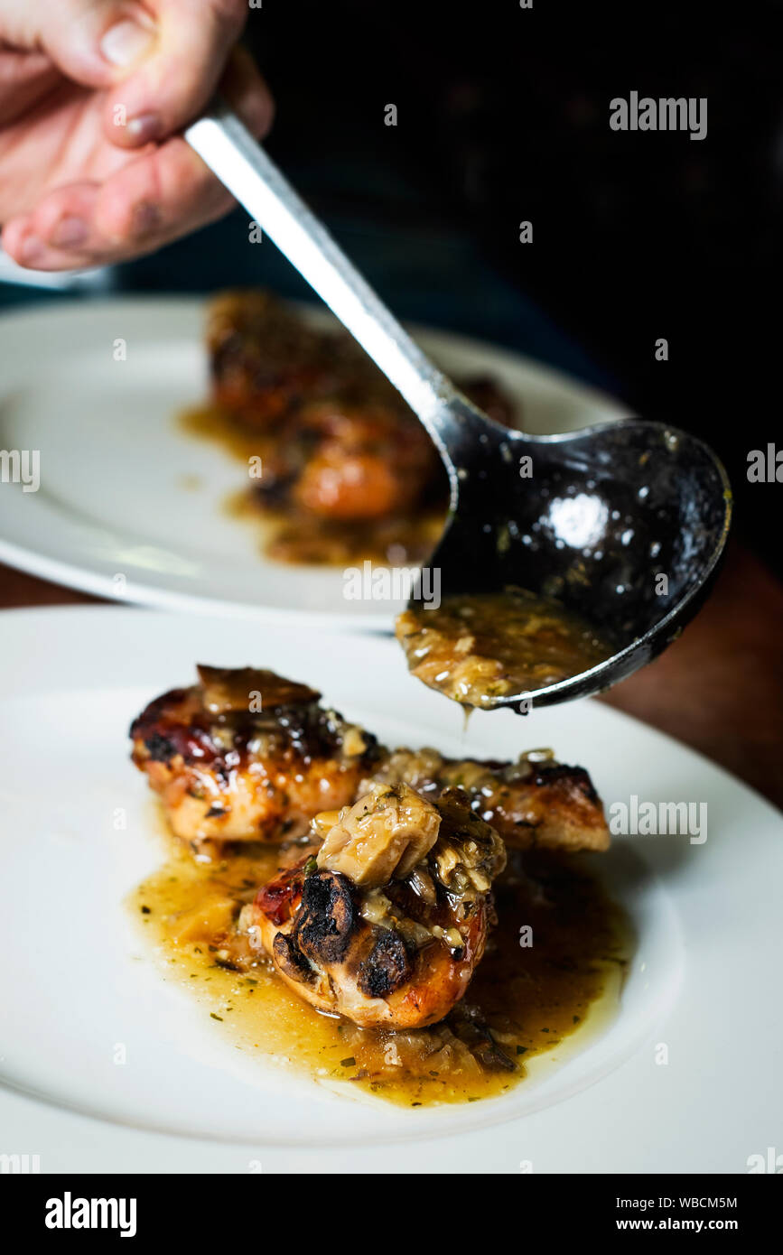 Man cooking roast chicken hi-res stock photography and images - Alamy