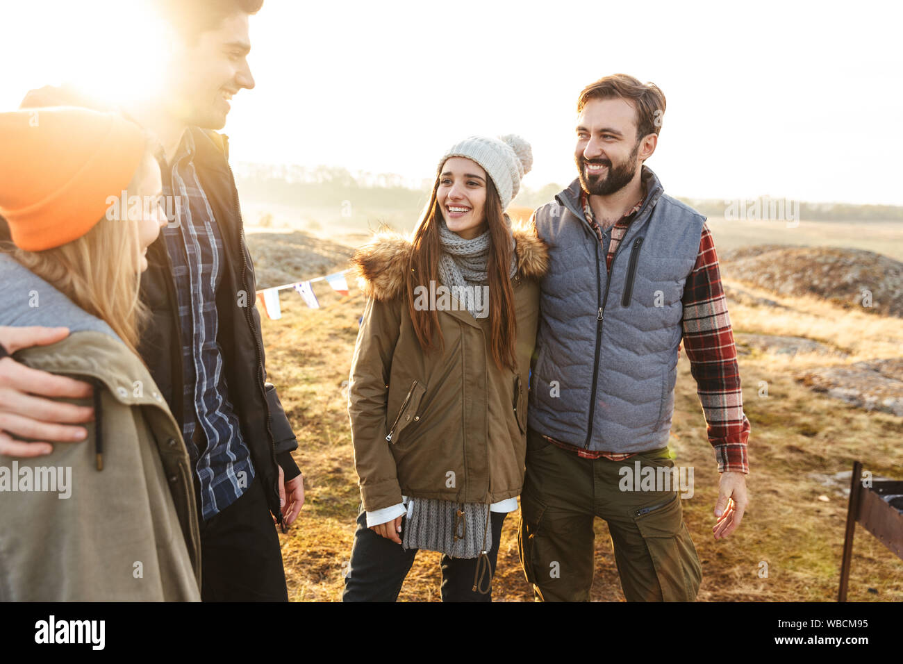 Photo of young group of friends outside in free alternative vacation ...