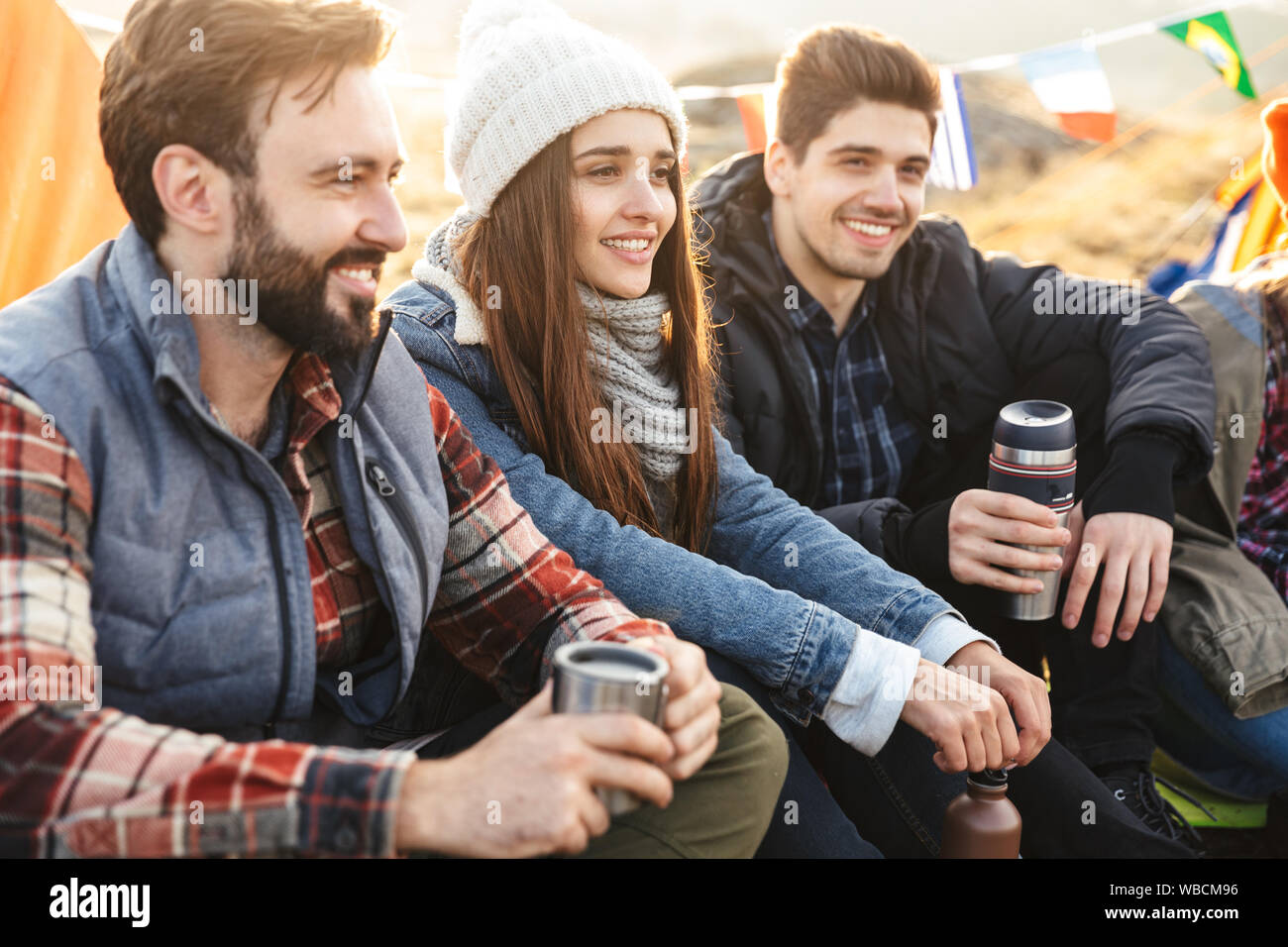 Photo of young group of friends outside in free alternative vacation ...