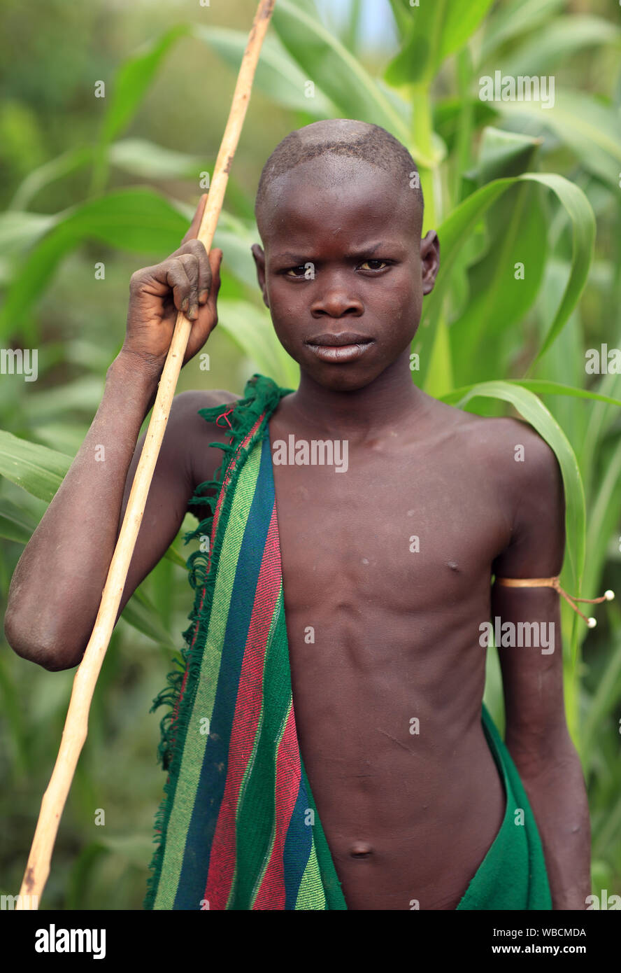 Young tribal Suri boy at a ceremony in Lower Omo Valley near Kibish ...
