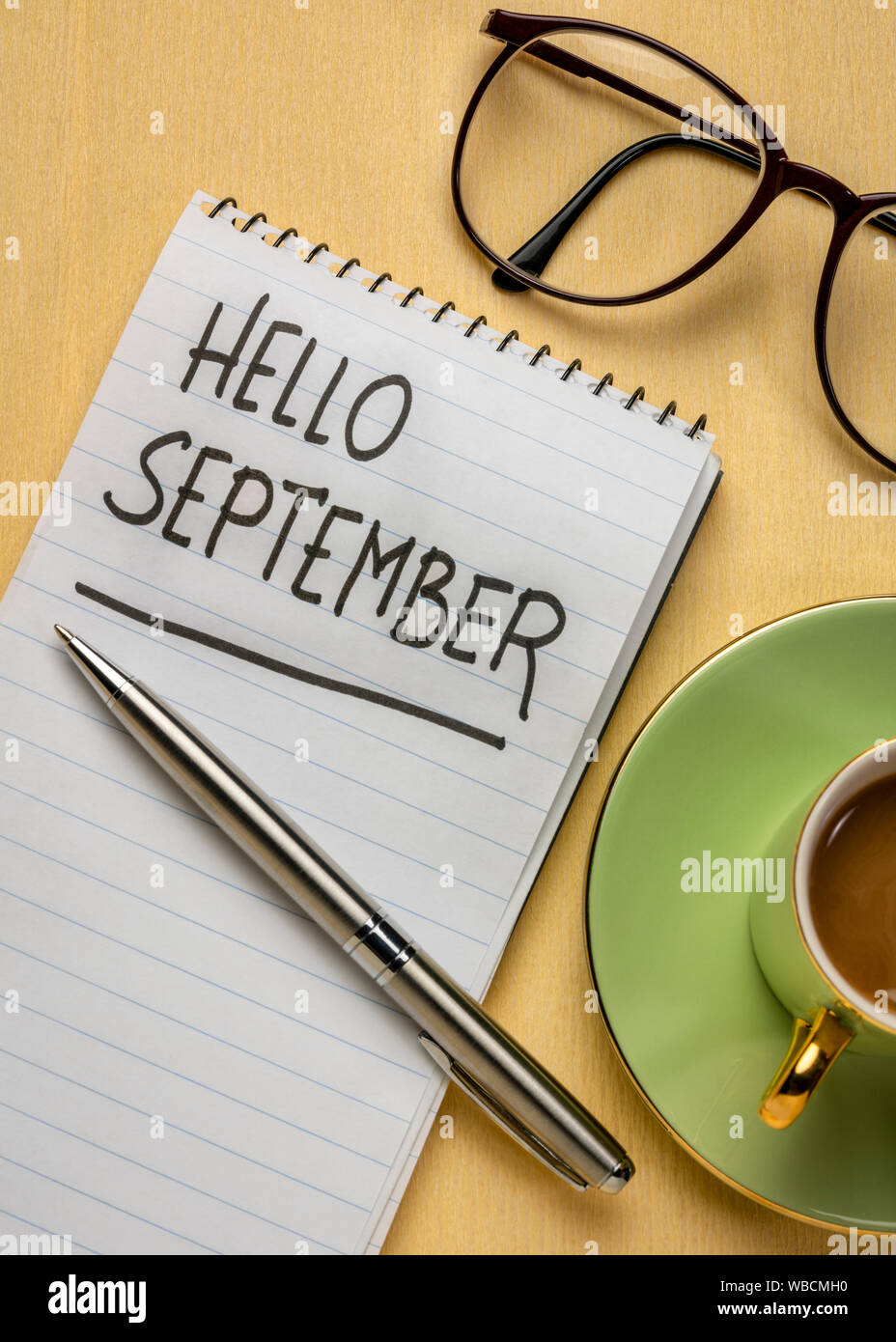 Hello September - handwriting in a spiral notebook with a cup of coffee ...