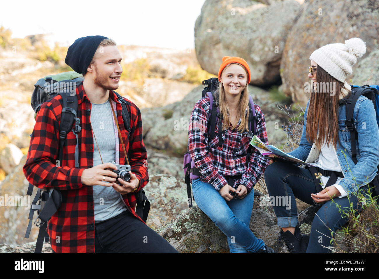 Photo of happy young group of friends outside in free alternative ...