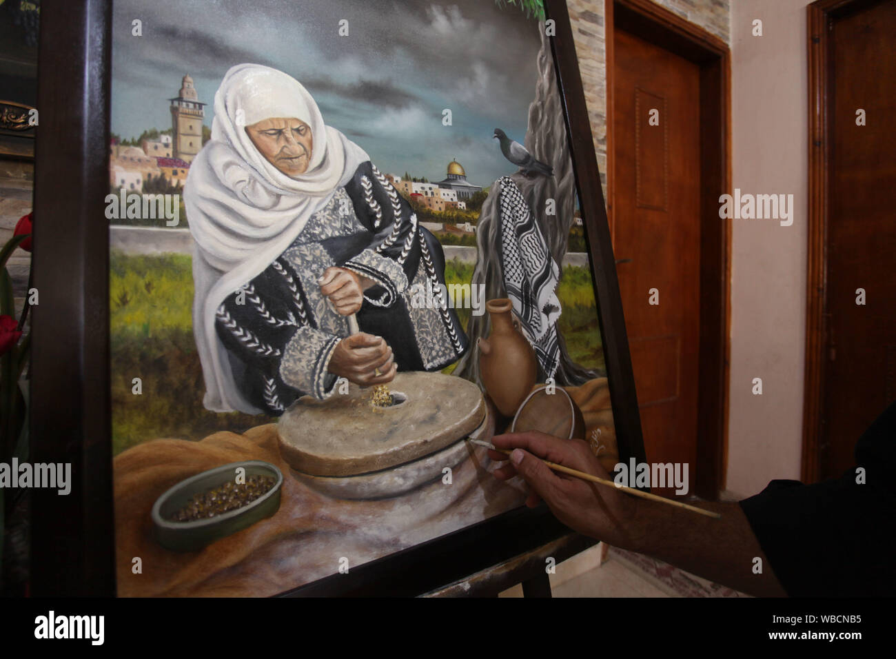 Nablus. 26th Aug, 2019. Palestinian artist Wael Rabie paints at his ...
