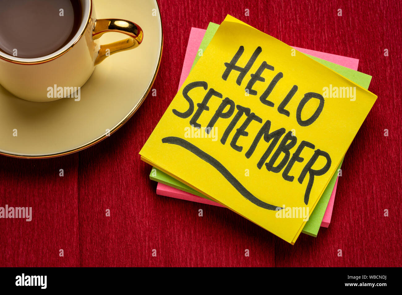 Hello September - handwriting on a sticky note with a cup of coffee ...