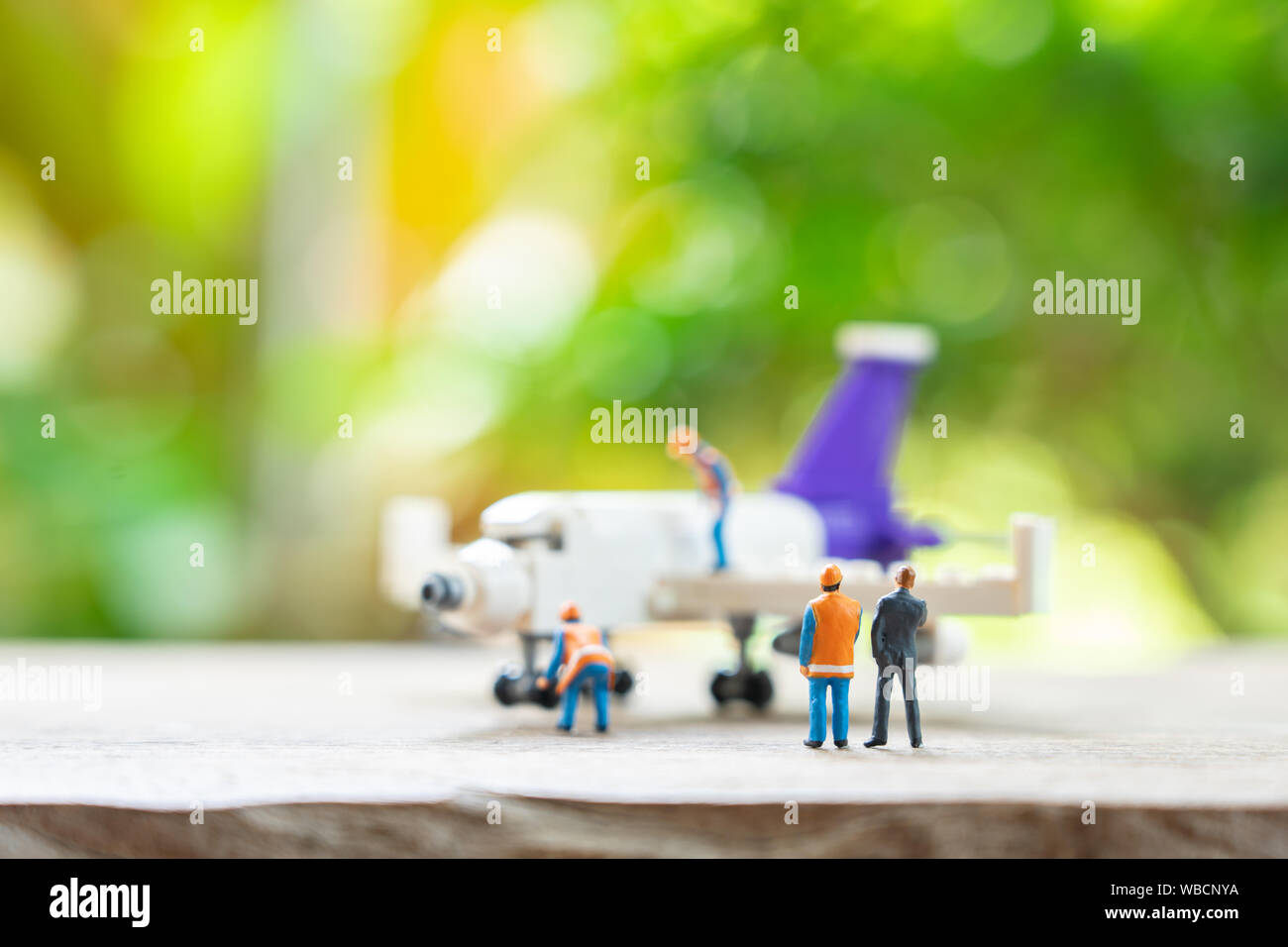 Miniature people Construction worker mechanical engineer Repair. using ...