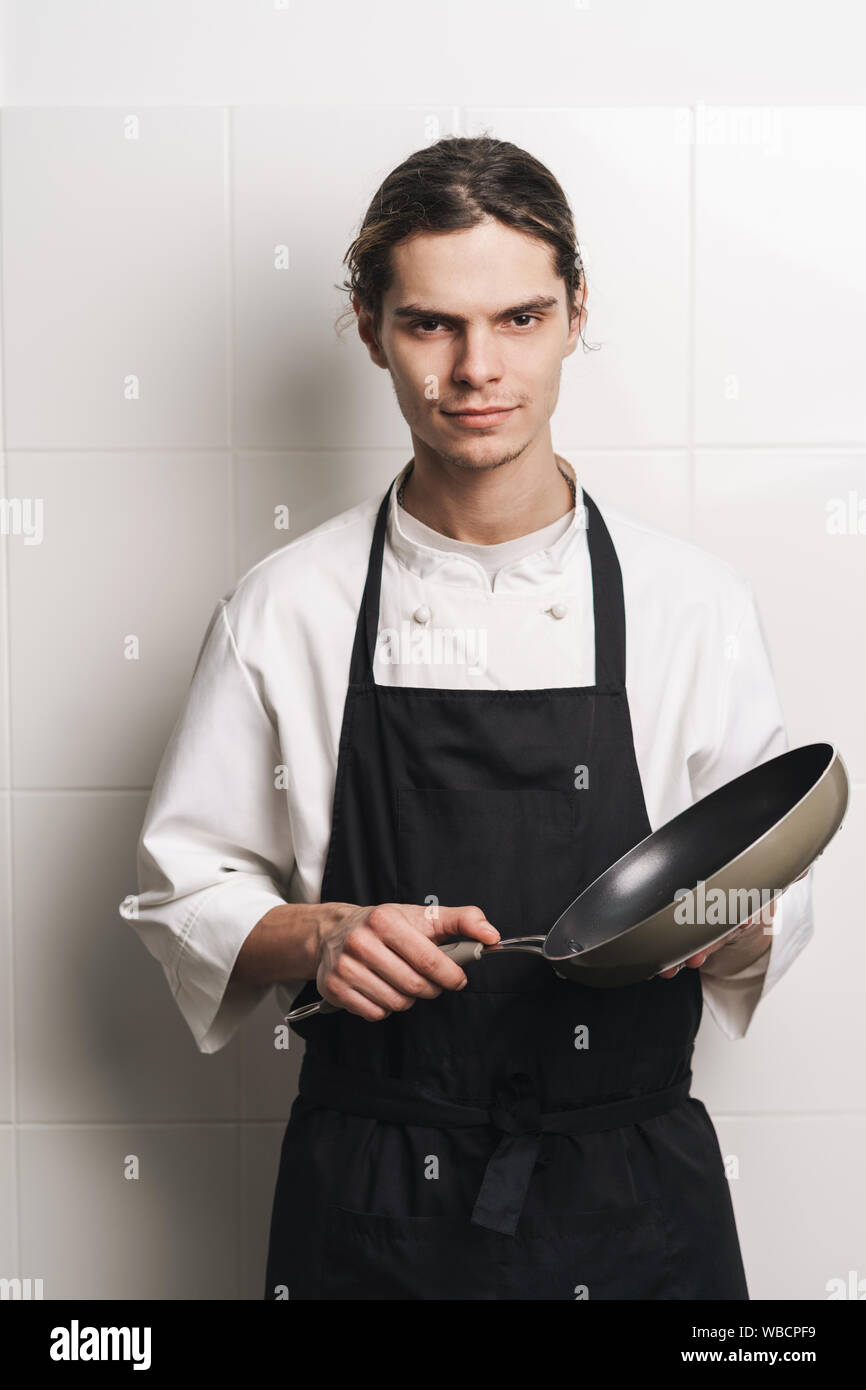 Kitchen staff serious hi-res stock photography and images - Alamy