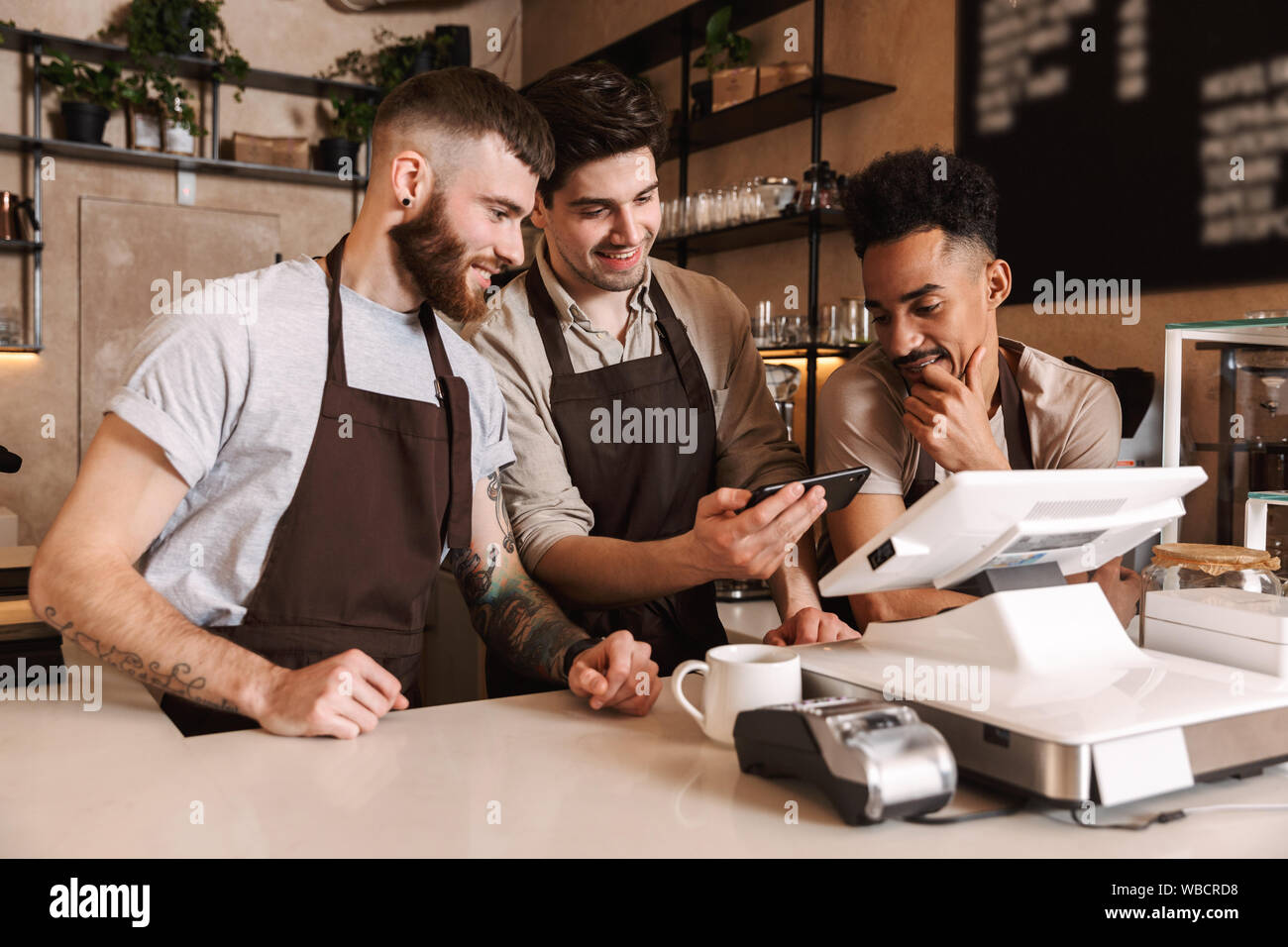 Behind counter baristas working hi-res stock photography and images - Alamy