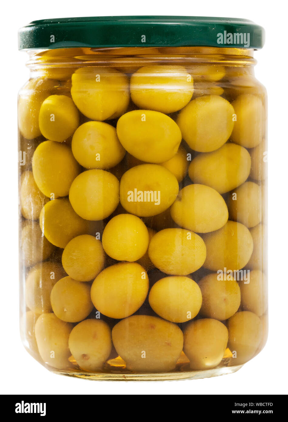 Glass jar of green unpitted olives in brine. Isolated over white ...