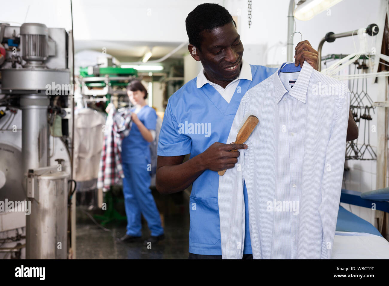 Sorting laundry african hi-res stock photography and images - Alamy