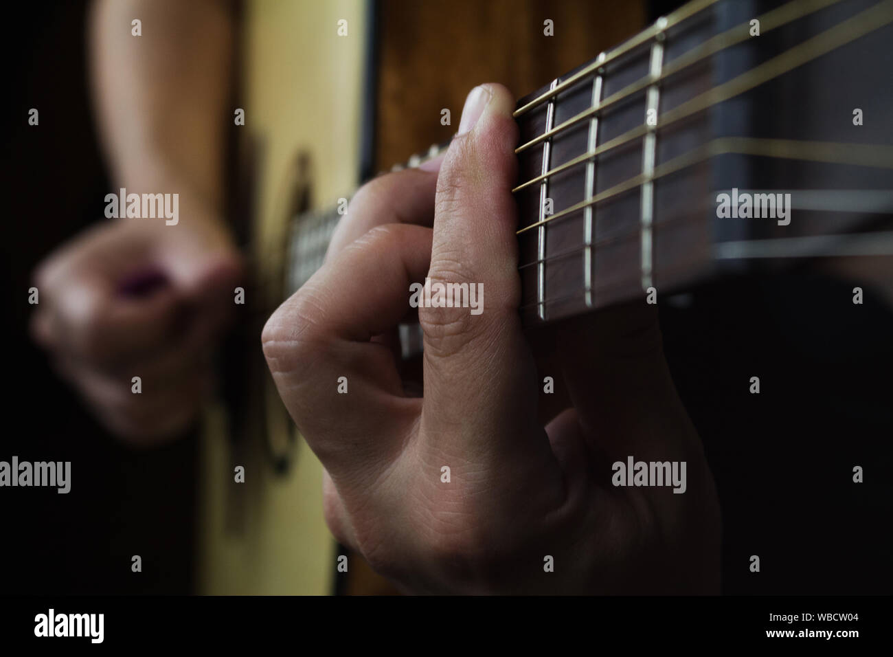 Acoustic Guitar Player Performing. Guitarist Playing In Music Studio ...