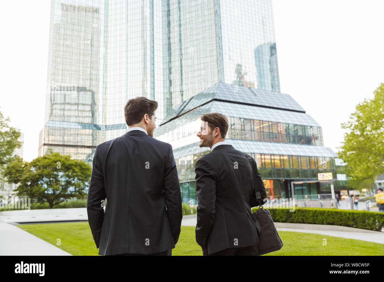 Back view of two businessmen at hi-res stock photography and images - Alamy