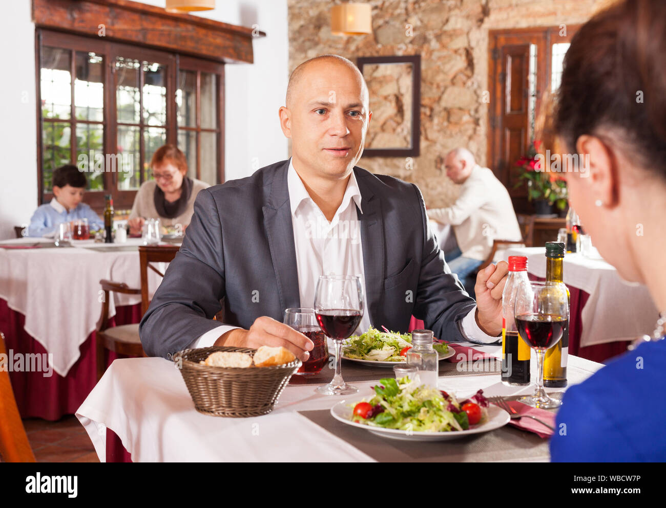 Happy couple spending time in restaurant and having nice talking Stock ...