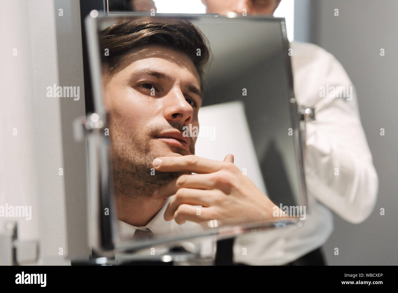 Man alone standing bathroom hi-res stock photography and images - Alamy