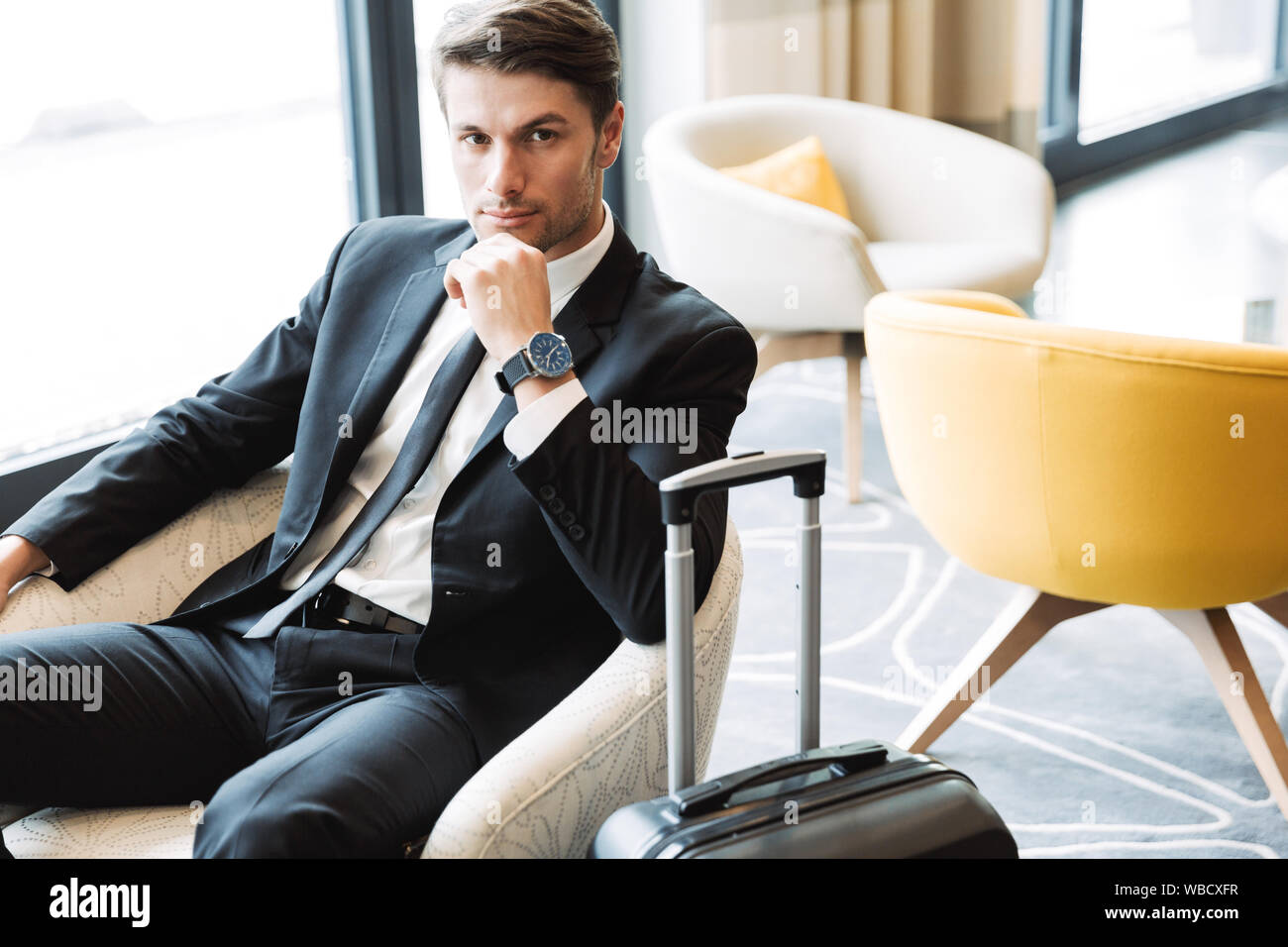 Photo Of Unshaven Young Businessman Wearing Formal Black Suit And