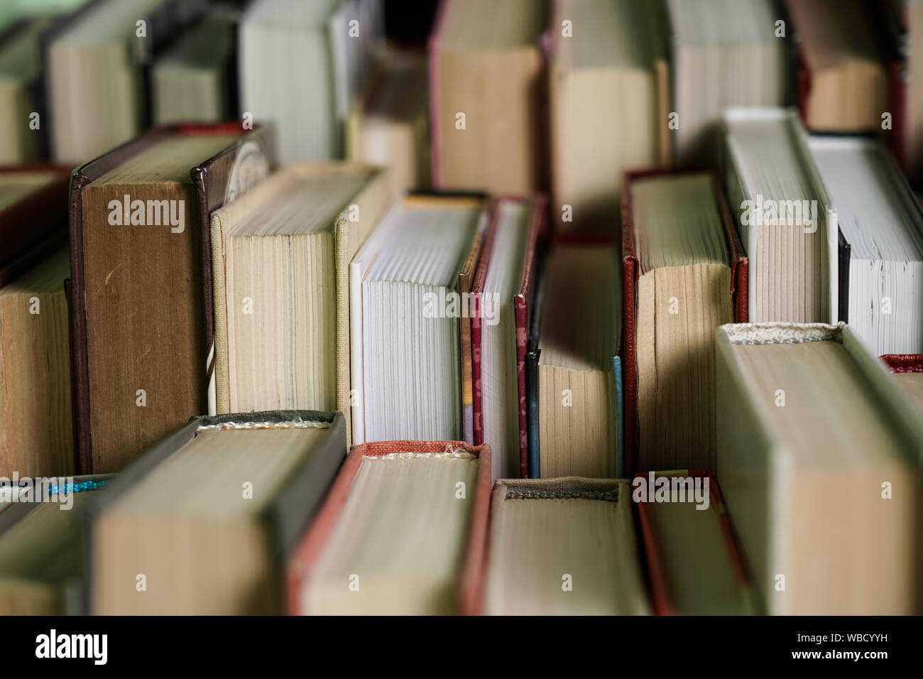 Stack of books background. many books piles Stock Photo - Alamy