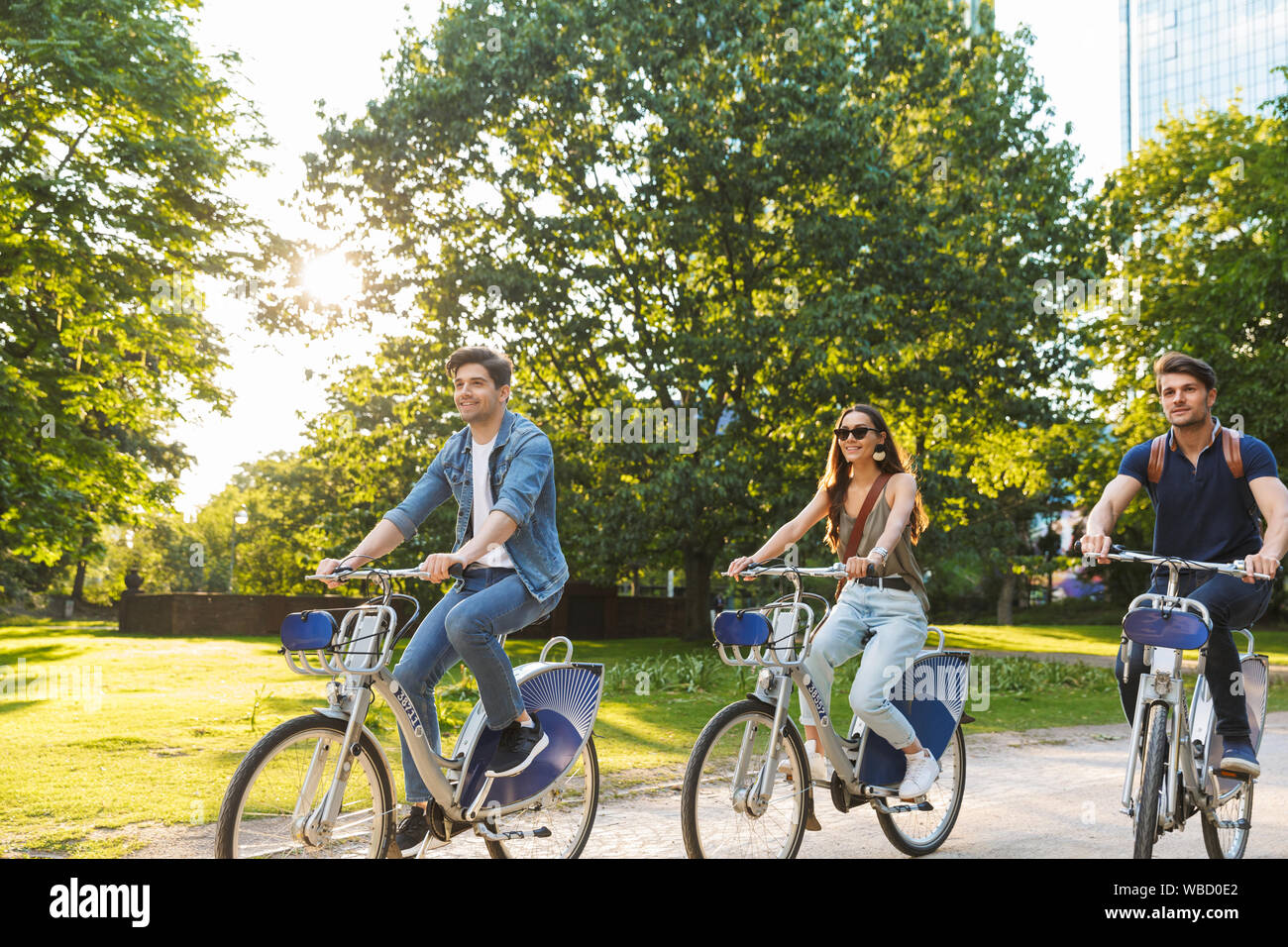 Bike ride together friends cycling woman bicycles hi-res stock ...