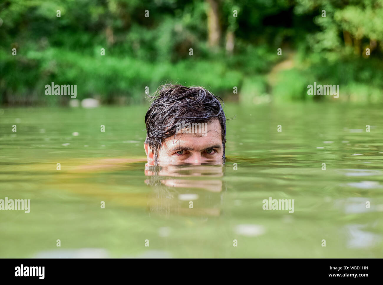 Man enjoy swimming in river or lake. Summer vacation. Relaxation and ...