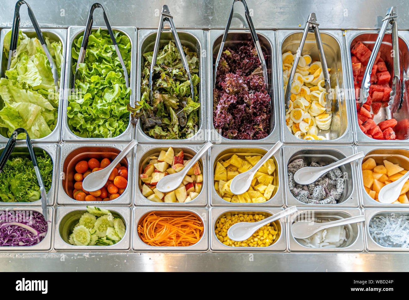 Top view of salad bar with various types of vegetables and fruits ...