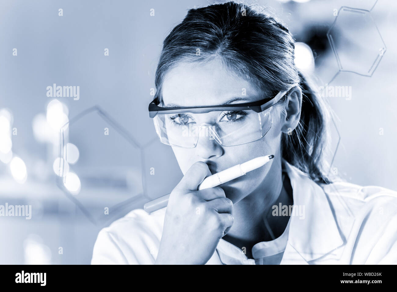 Portrait of a confident female researcher in life science laboratory ...