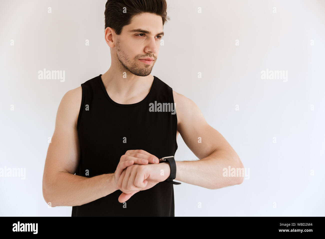 Image of a handsome concentrated young sports man isolated over white ...